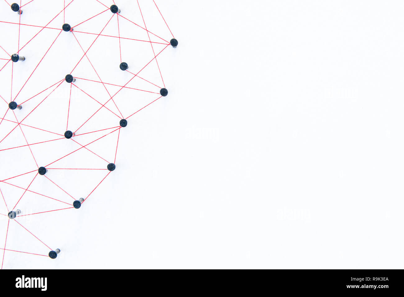 Connecting networks concept - network connected with yarn red on white ...