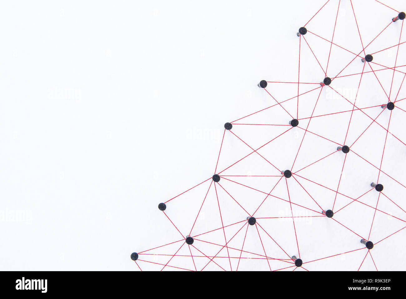 Connecting networks concept - network connected with yarn red on white ...