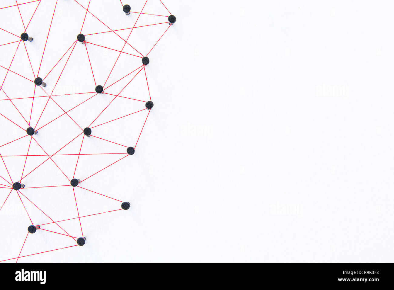 Connecting networks concept - network connected with yarn red on white ...