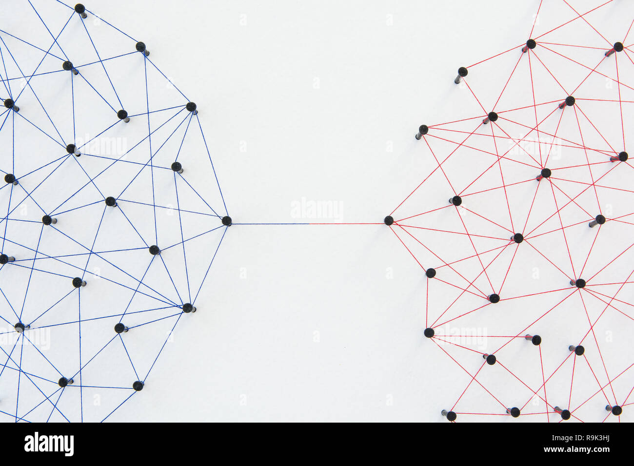 Connecting networks concept - two network connected with yarn red and ...
