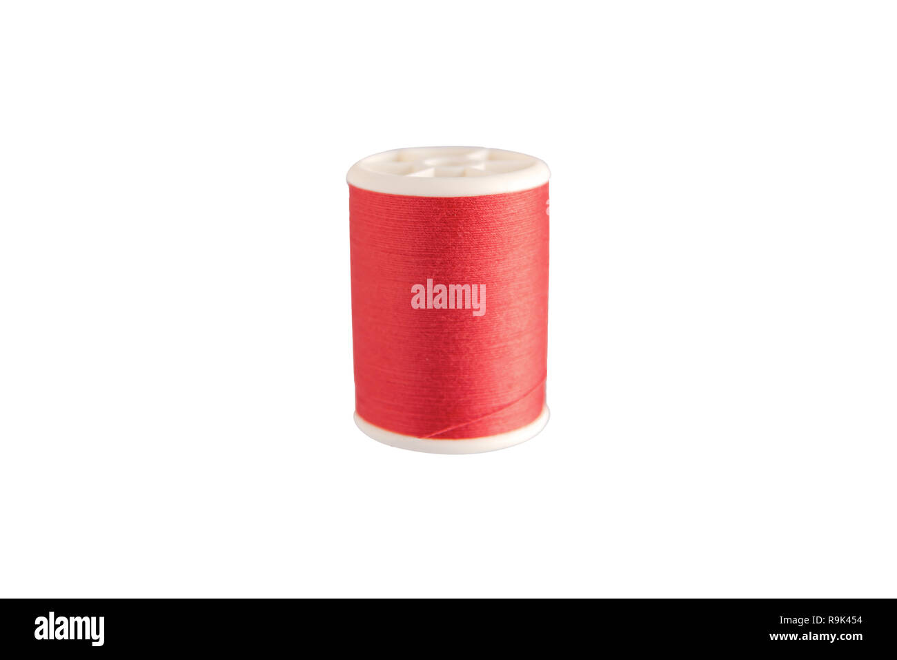 Roll red thread bobbin thread isolated on white background with ...