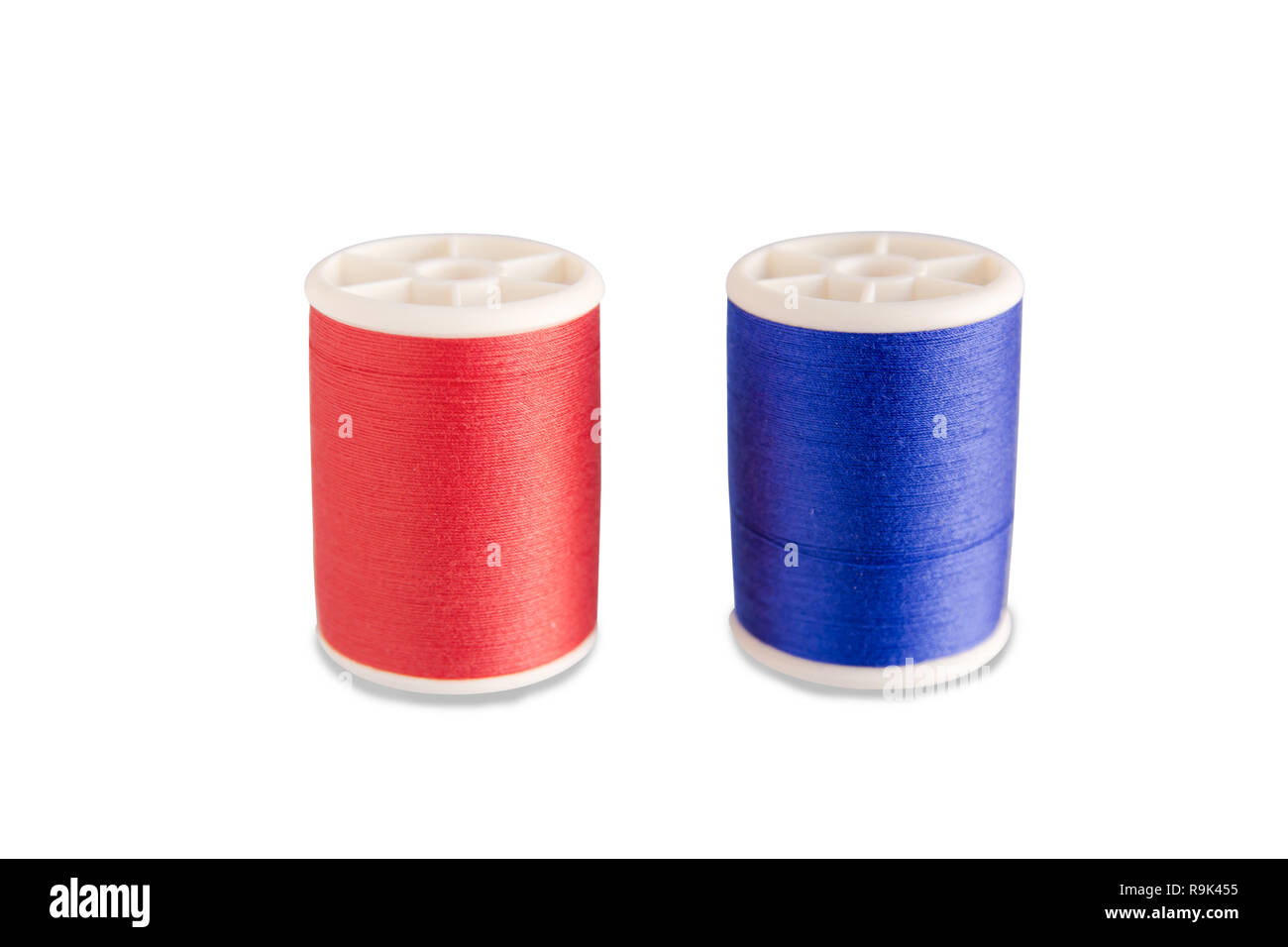 Roll red and blue thread bobbin thread isolated on white background ...