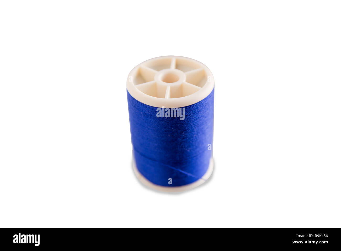 Roll blue thread bobbin thread isolated on white background with ...