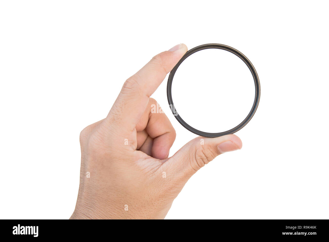 hand holding clear camera filter isolated on white with clipping path ...