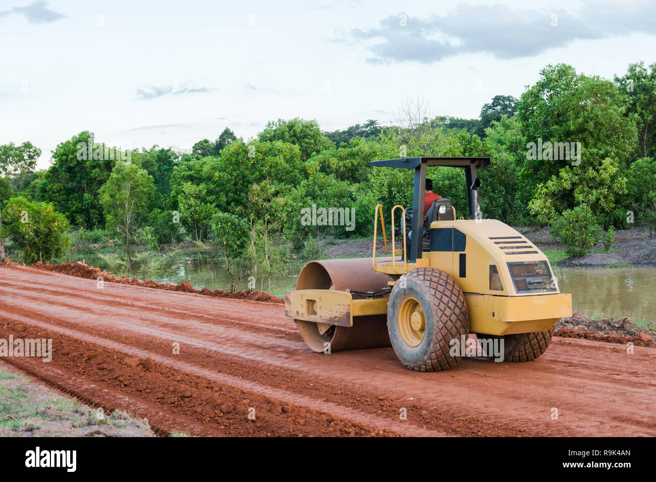 Roller steamroller or vibratory roller machine working on road ...