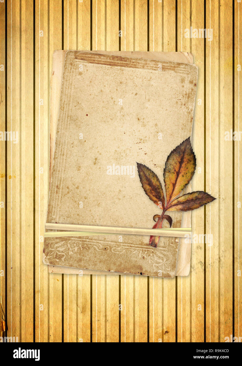 Old cards and dry leaf on old paper Stock Photo - Alamy