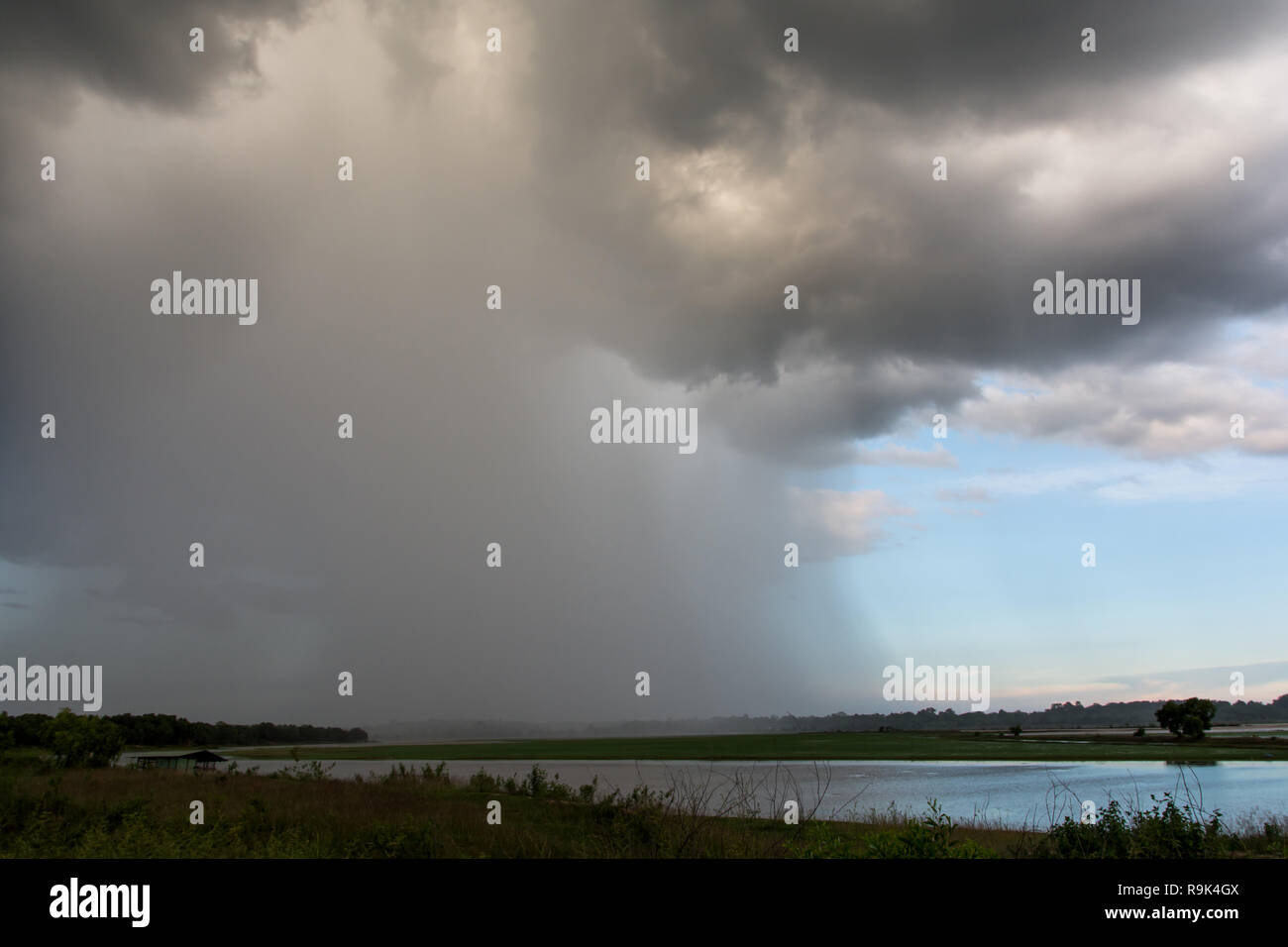 Thunder storm or storm clouds with rain over forest with river Stock ...