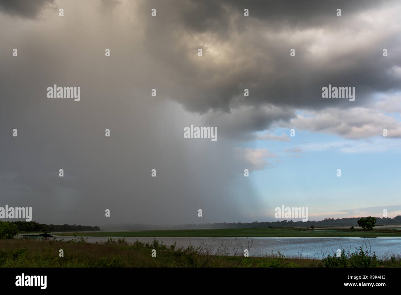 Thunder storm or storm clouds with rain over forest with river Stock ...