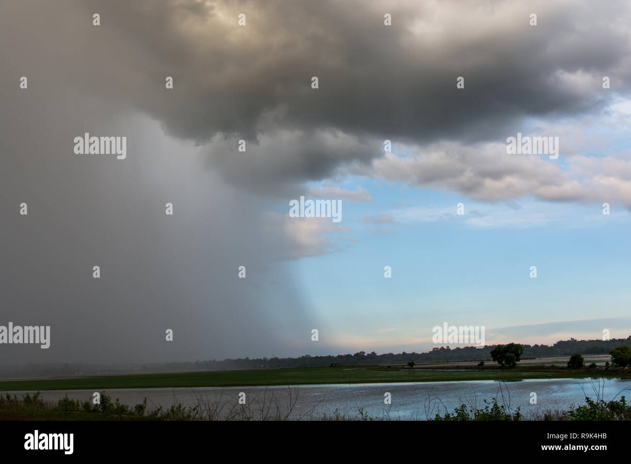 Thunder storm or storm clouds with rain over forest with river Stock ...