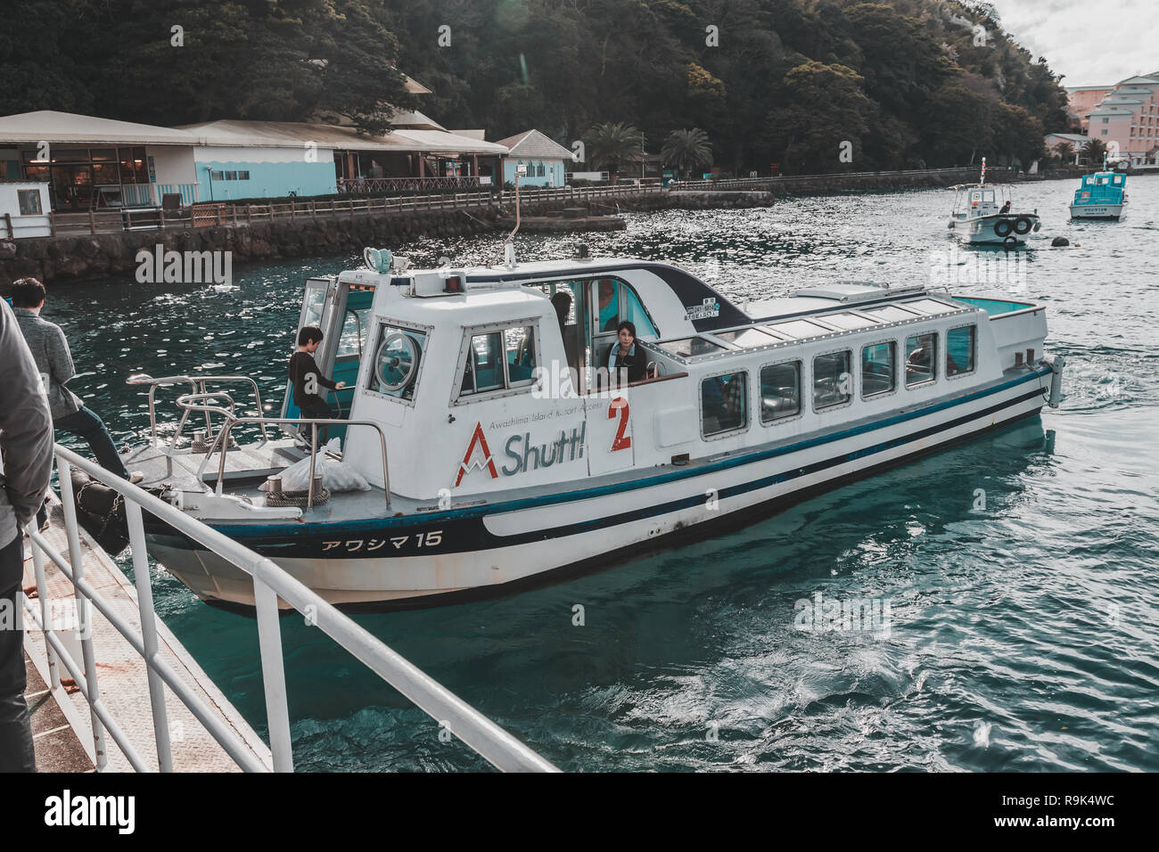 Shuttle Ferry docking at Awashima Marine Park waiting for the passenger ...