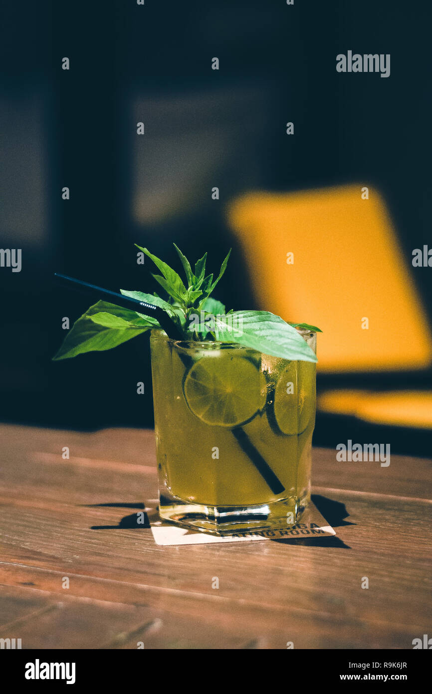cocktail with lime slices and leaves in a glass Stock Photo - Alamy