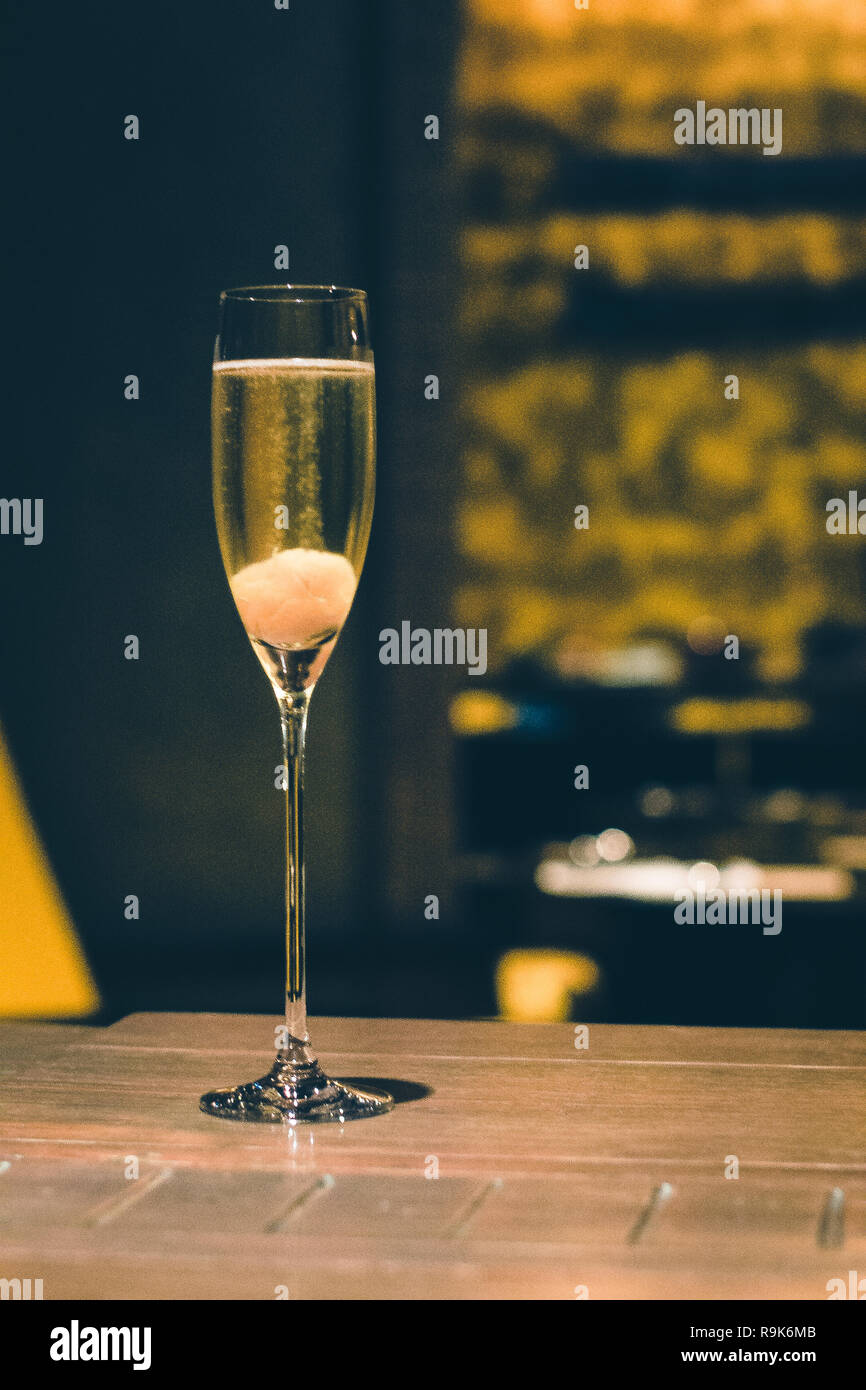 Champagne cocktail with lychee in a flute Stock Photo - Alamy