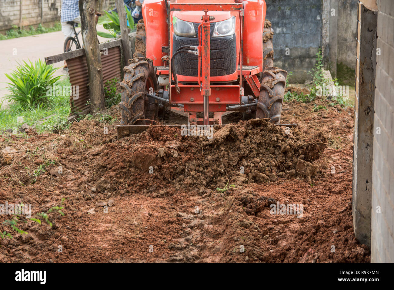 Tractor grader soil working on gravel leveling for Stock Photo - Alamy