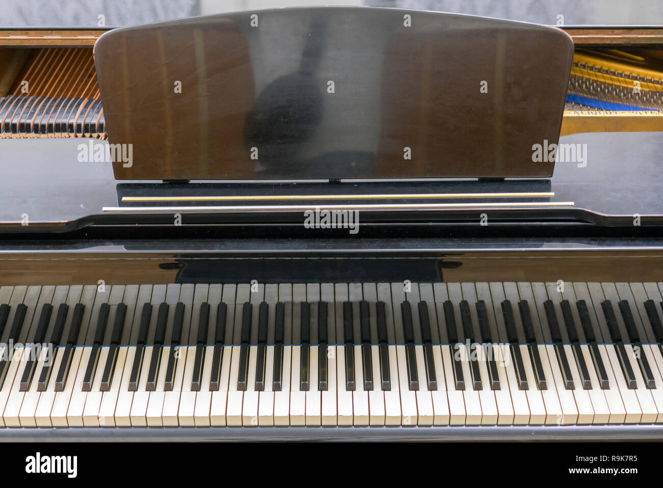 Old piano keys. Piano keyboard, see black and white keys, the wooden ...