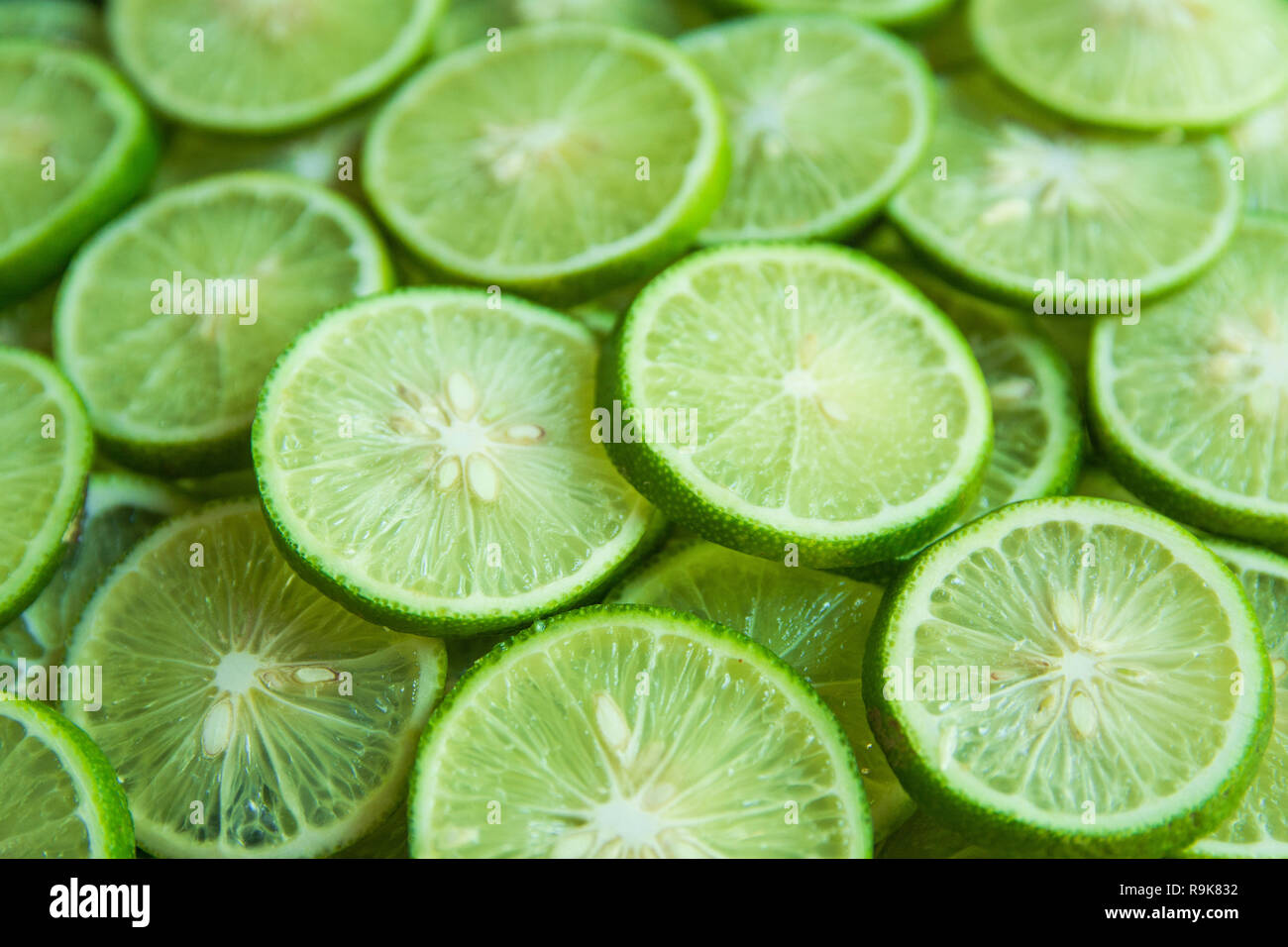 Citrus fruit of lime slices background Stock Photo - Alamy