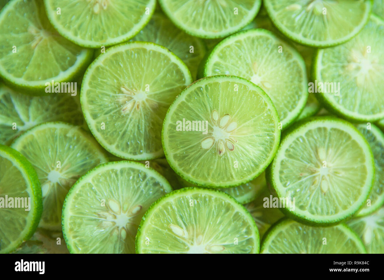 Citrus fruit of lime slices background Stock Photo - Alamy