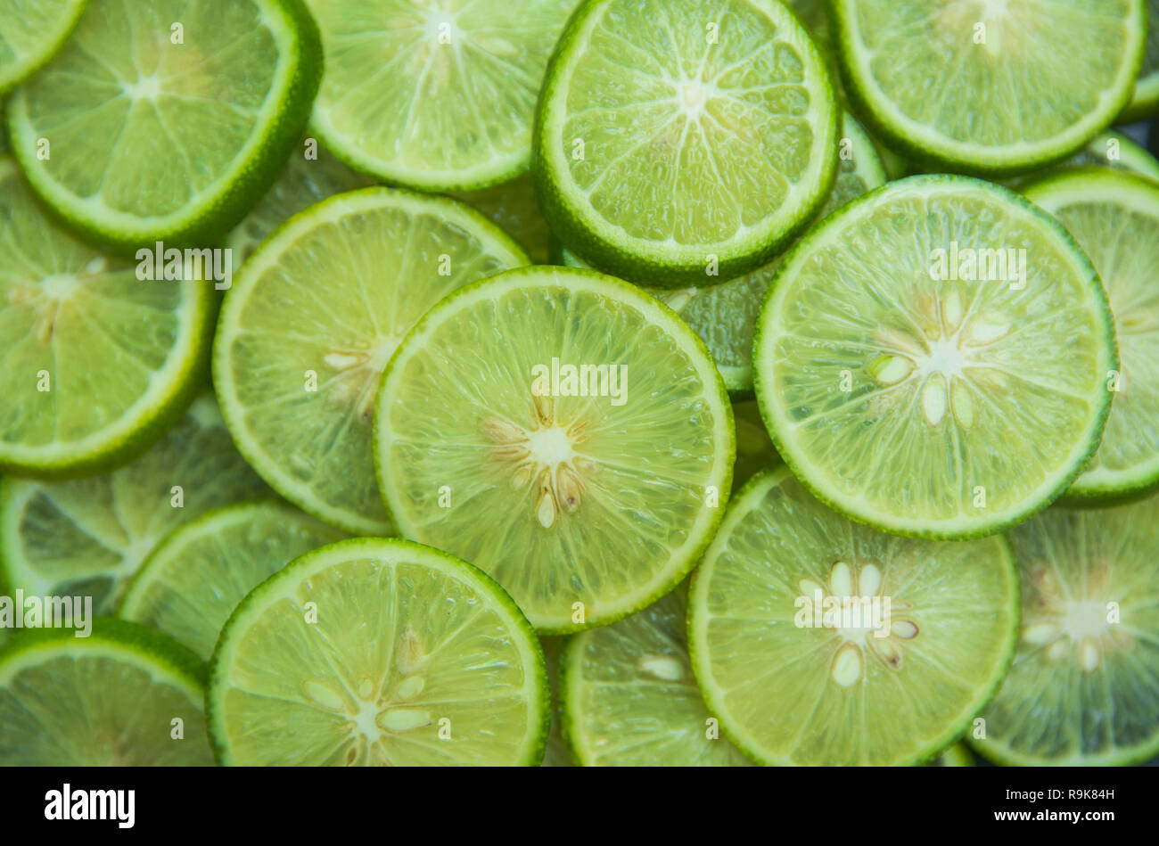 Citrus fruit of lime slices background Stock Photo - Alamy