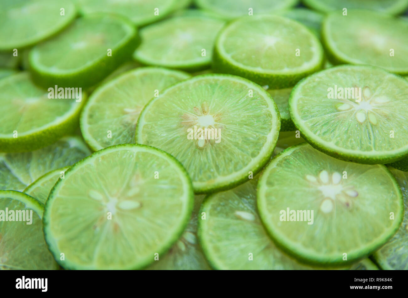 Citrus fruit of lime slices background Stock Photo - Alamy