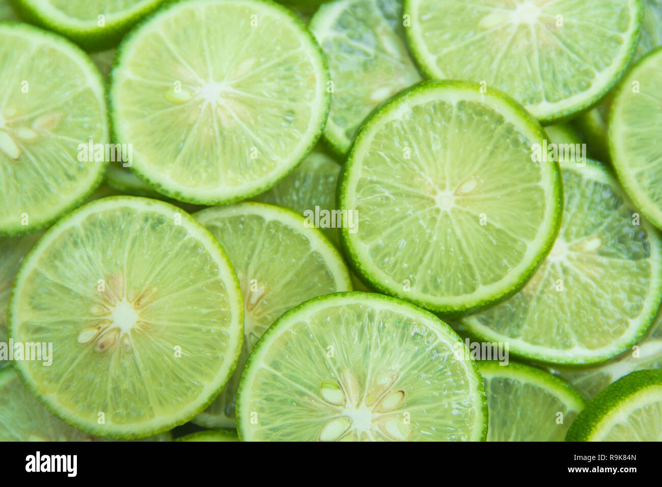 Citrus fruit of lime slices background Stock Photo - Alamy