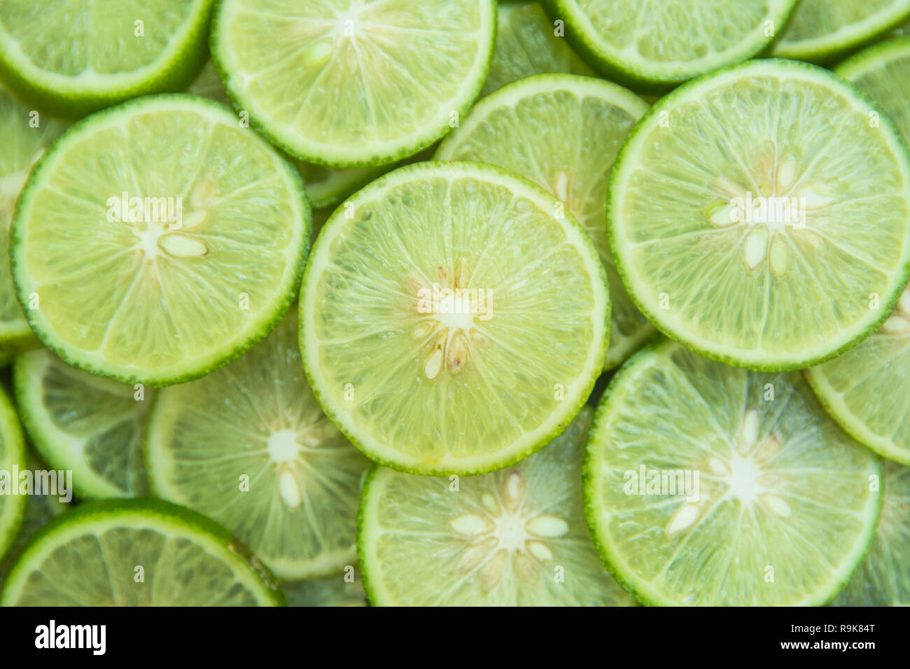 Citrus fruit of lime slices background Stock Photo - Alamy