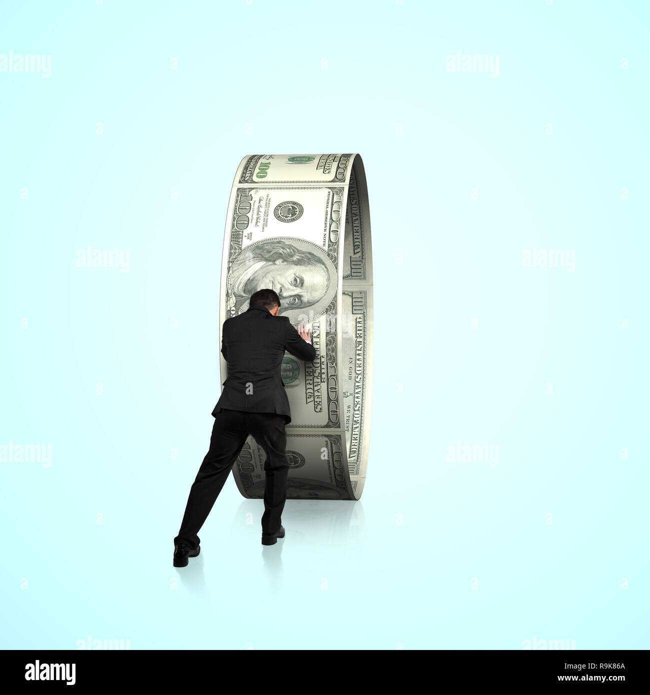 Rear view businessman pushing money circle in blue background Stock ...