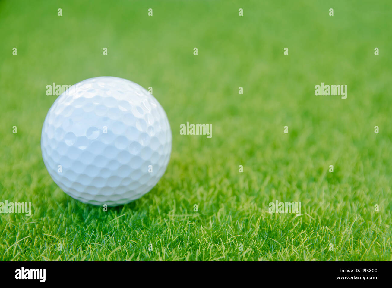 Golf ball on green grass ready to play at golf course. with copy space ...