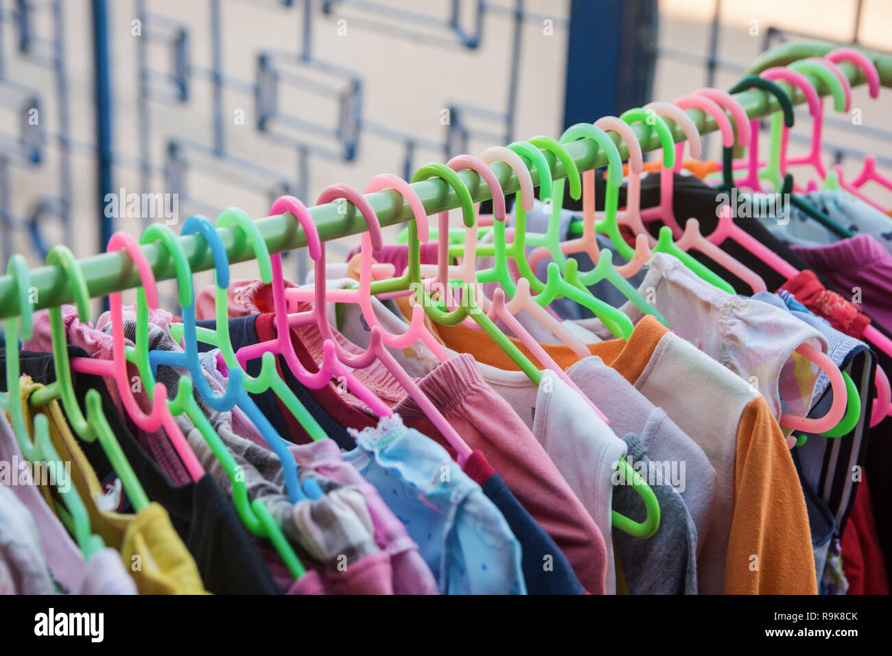Colorful clothes Hanger on a shelf Stock Photo - Alamy
