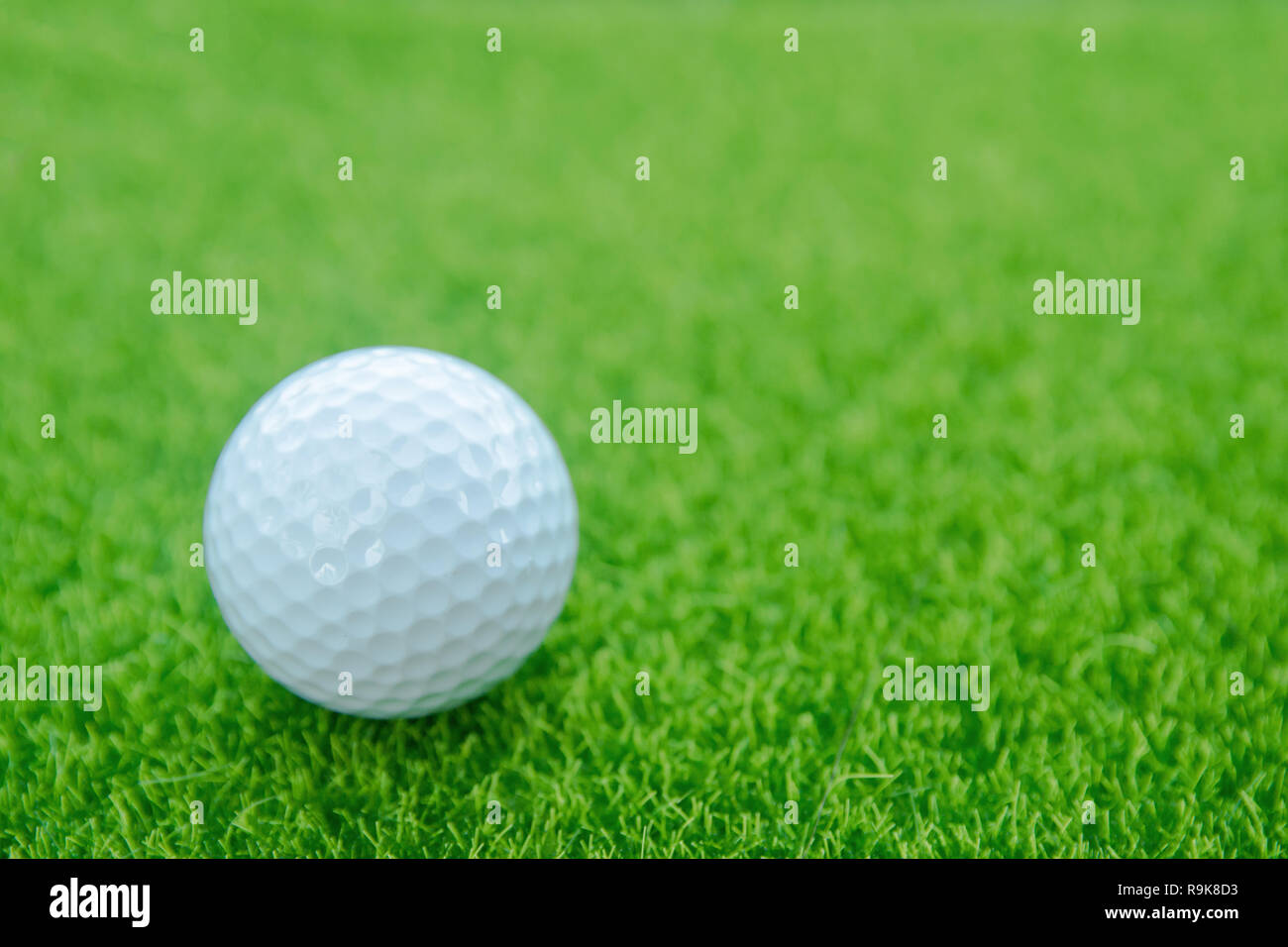 Golf ball on green grass ready to play at golf course. with copy space ...