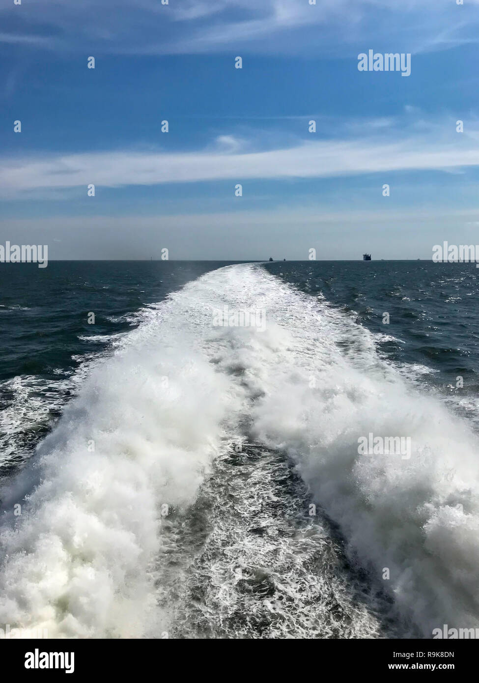 A water splash from the jet stream of a ferry boat creating big waves ...