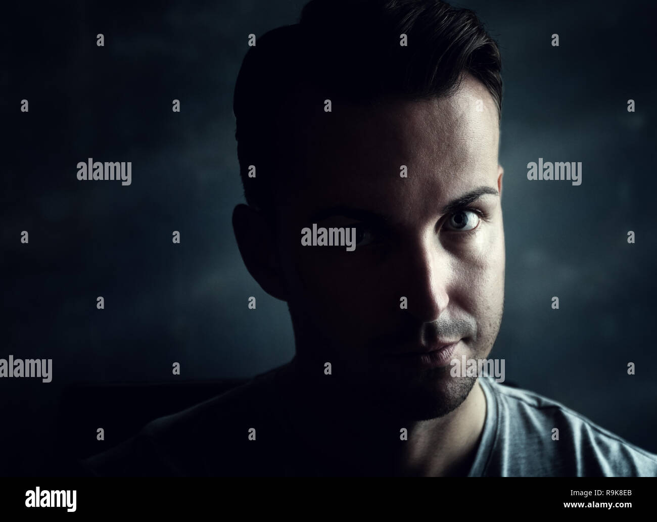 Young male model with a forceful mysterious look at a character ...