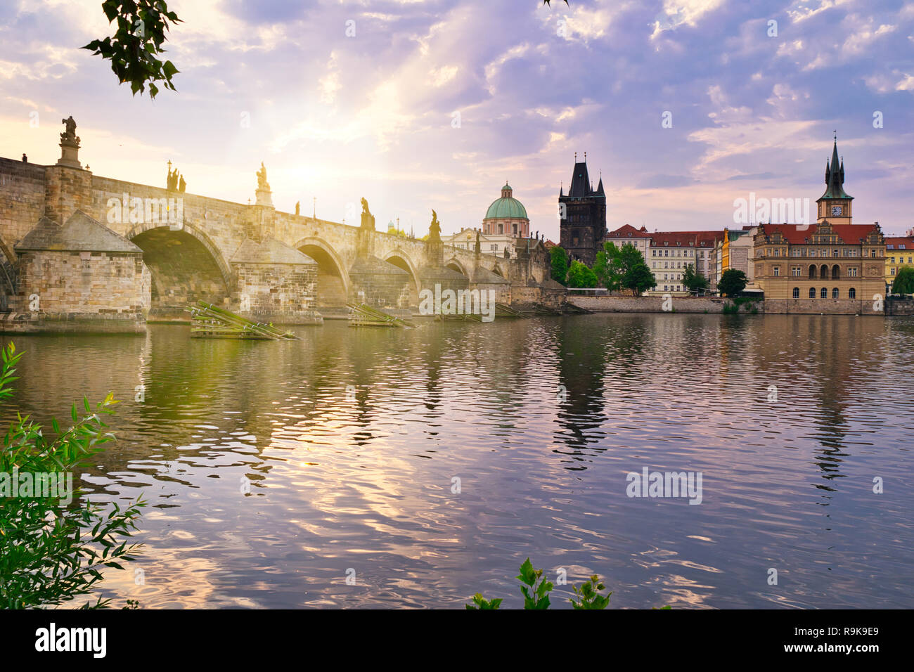 Sunrise at the Charles Bridge of Prague city. A fresh morning view of Prague. Travel destination ...