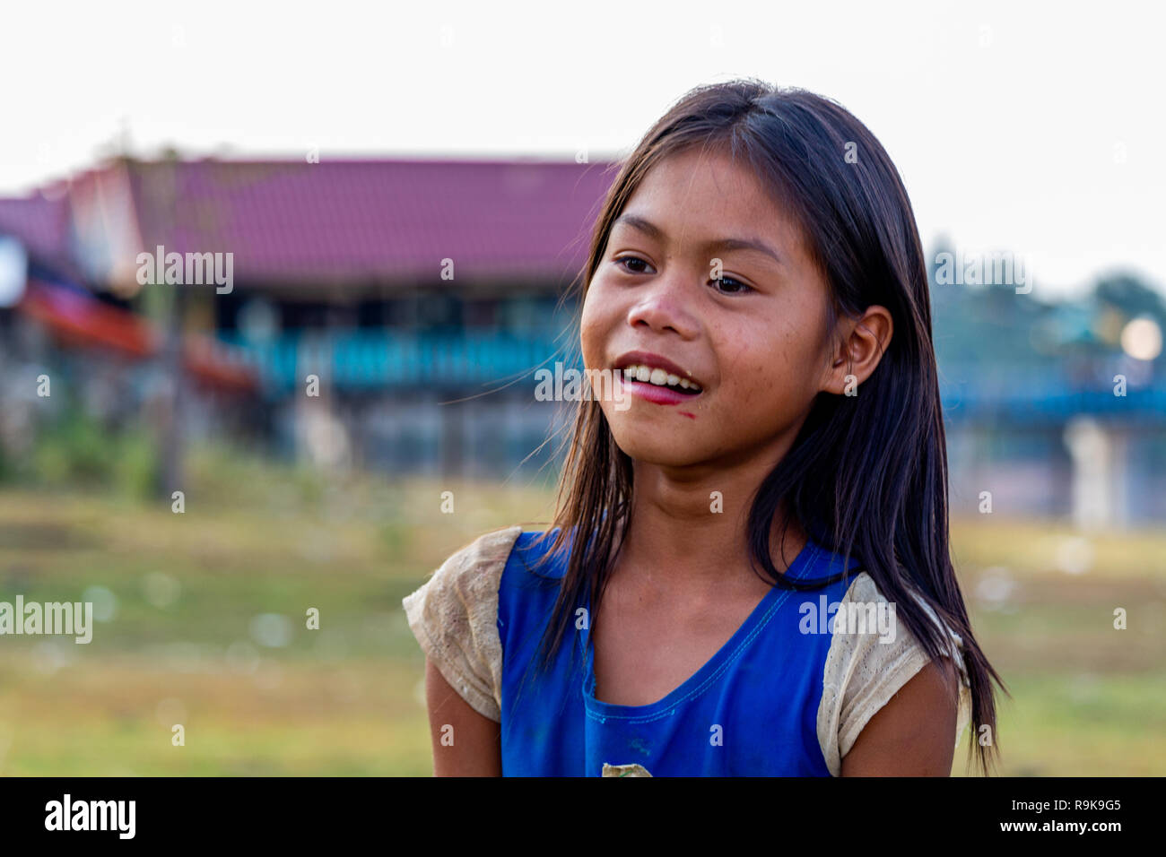 Thakhek, Laos - April 19 2018: Local girl smiling in a remote village ... Thakhek, Laos - April 19 2018: Local girl smiling in a remote village ...