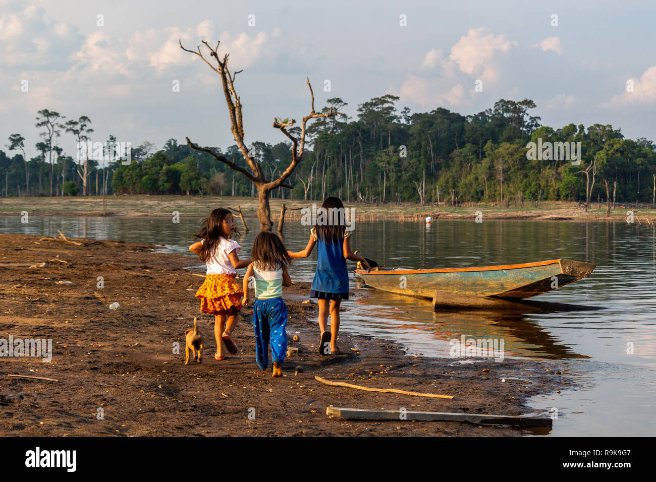 Thakhek, Laos - April 19 2018: Children and a dog walking through a ...