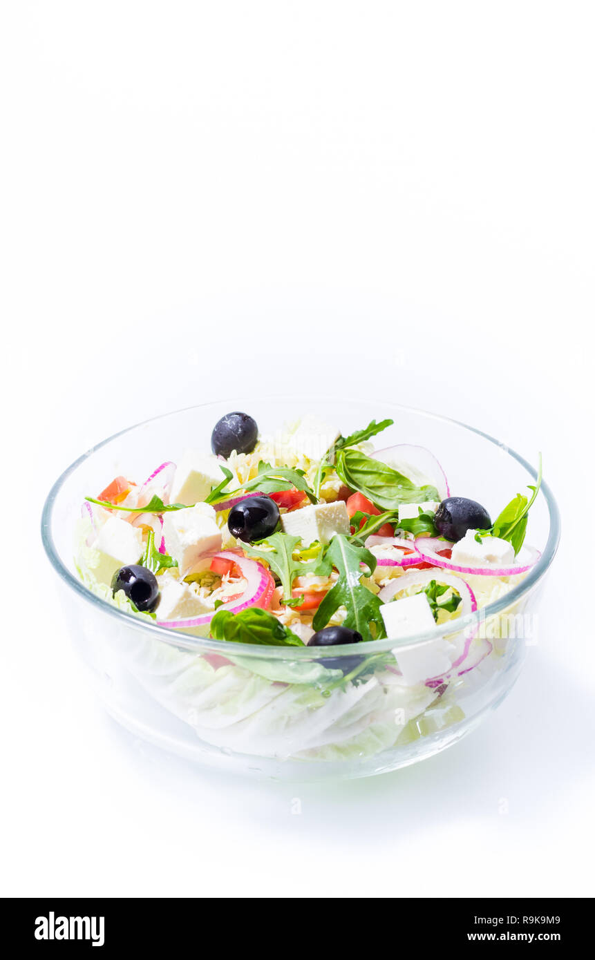 Salad from vegetables and olives. Salad in a transparent bowl. Salad ...