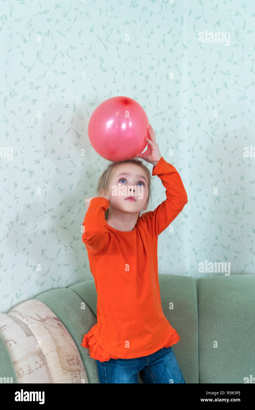 child hits the balloon Stock Photo - Alamy