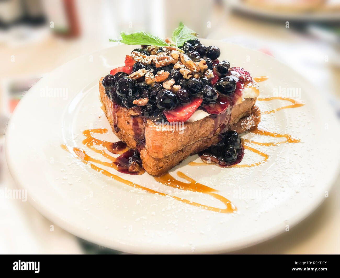 Breakfast of french toast with fresh berries and maple syrup Stock ...