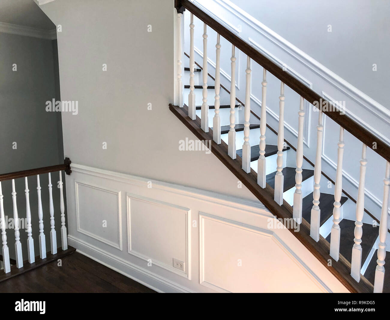 White staircase with wood steps Stock Photo - Alamy