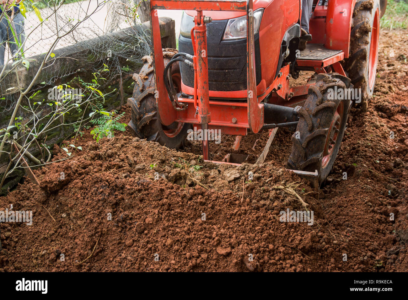 Tractor grader soil working on gravel leveling for Stock Photo - Alamy