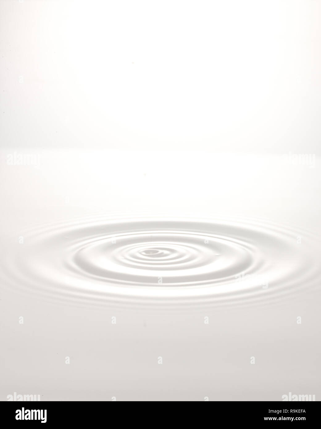 a wave after the drop of milk Stock Photo - Alamy