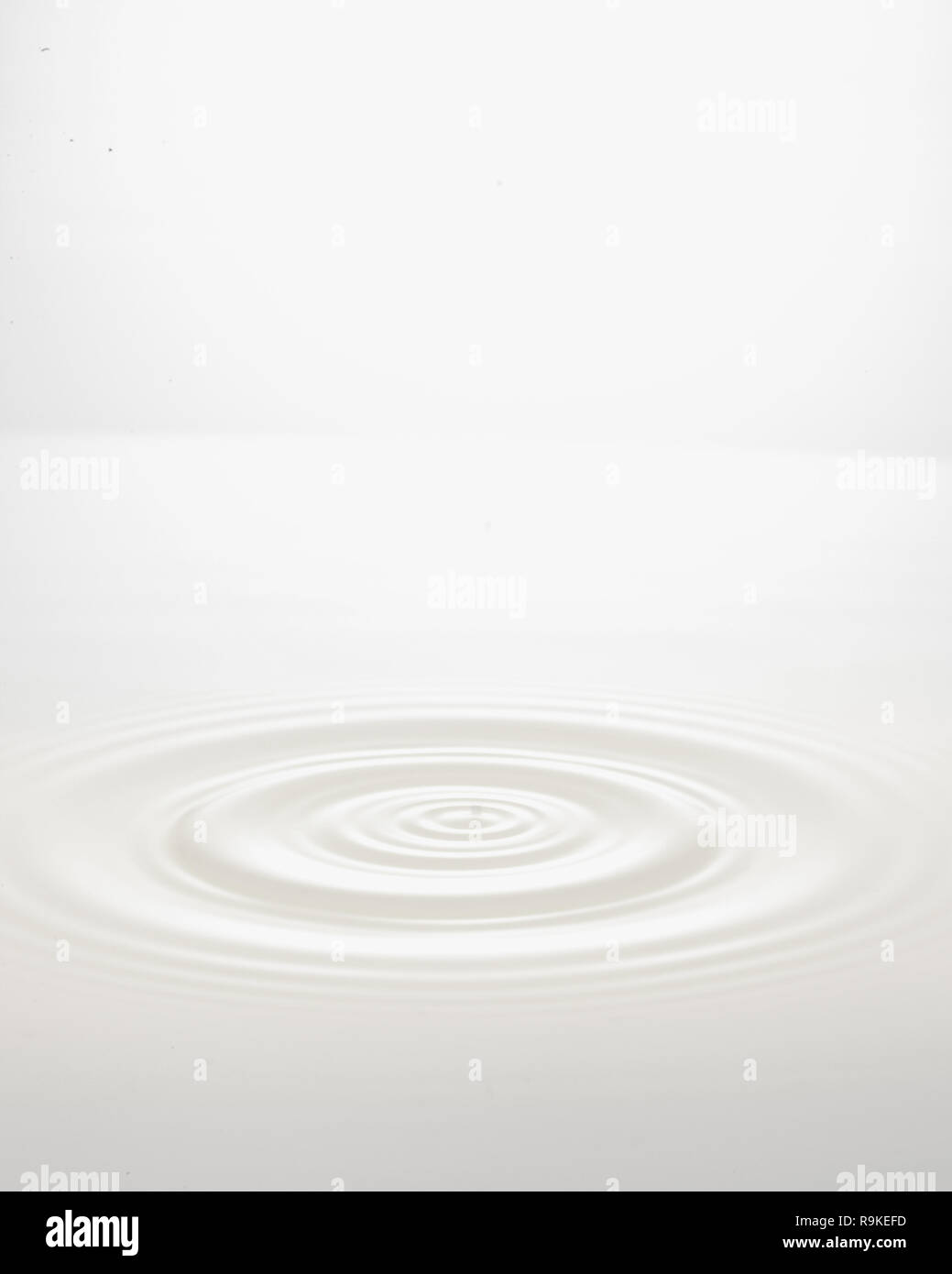 a wave after the drop of milk Stock Photo - Alamy