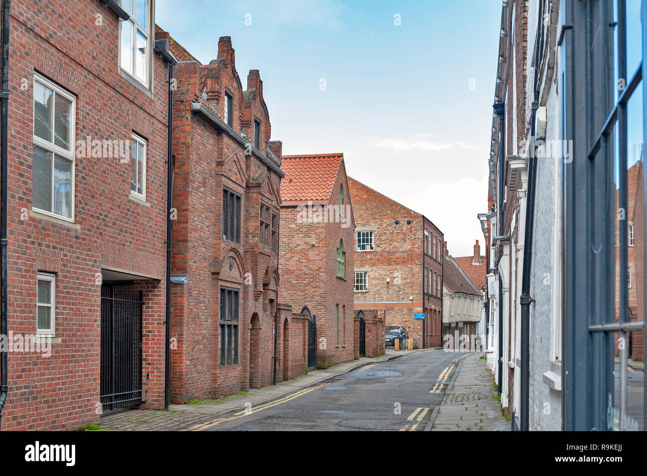 York, England - April 2018: Old brick buildings along Ogleforth Street ...