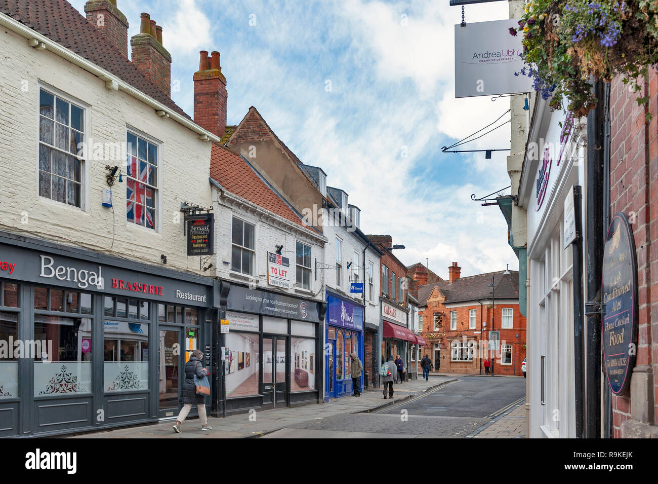 York, England - April 2018: Old buildings along Goodramgate shopping ...