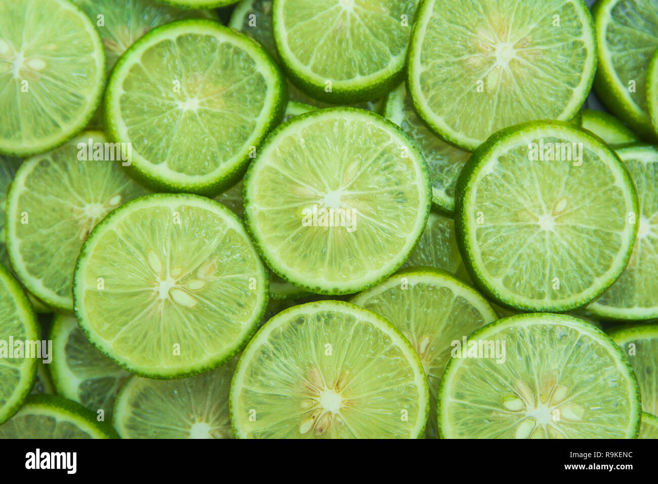Citrus fruit of lime slices background Stock Photo - Alamy
