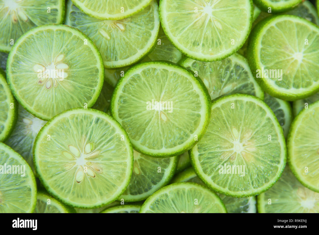 Citrus fruit of lime slices background Stock Photo - Alamy