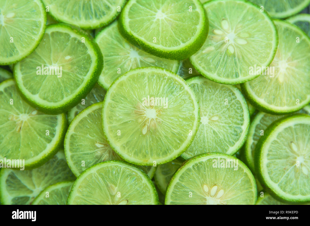 Citrus fruit of lime slices background Stock Photo - Alamy