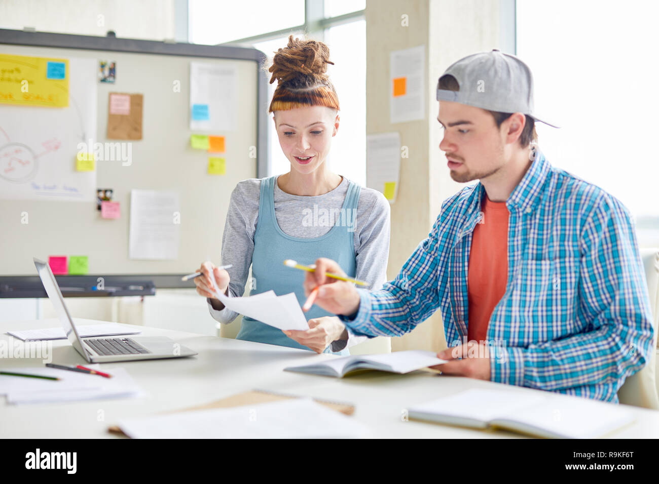 Working in classroom Stock Photo - Alamy