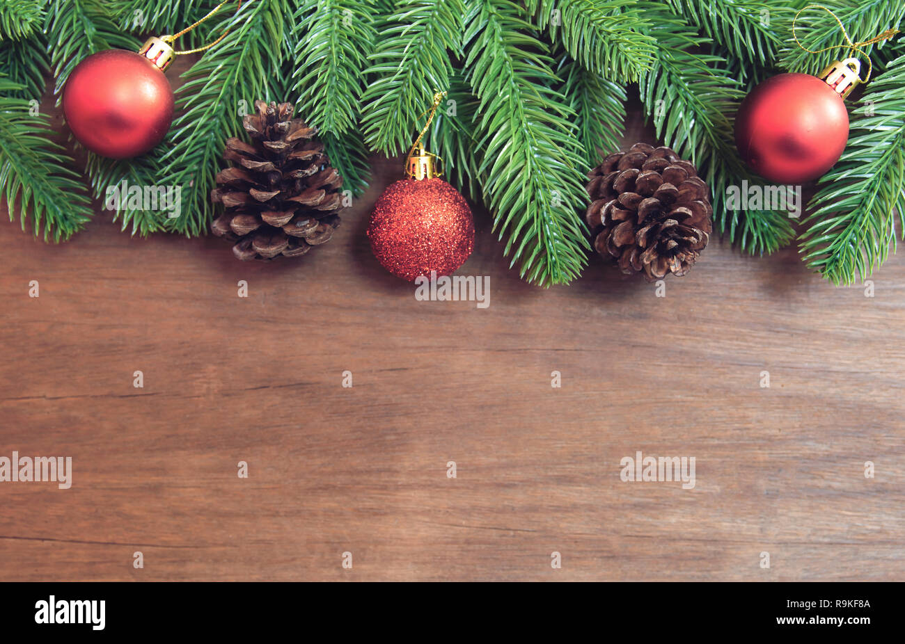Christmas background. Fir tree branches, red Christmas ball and pine ...