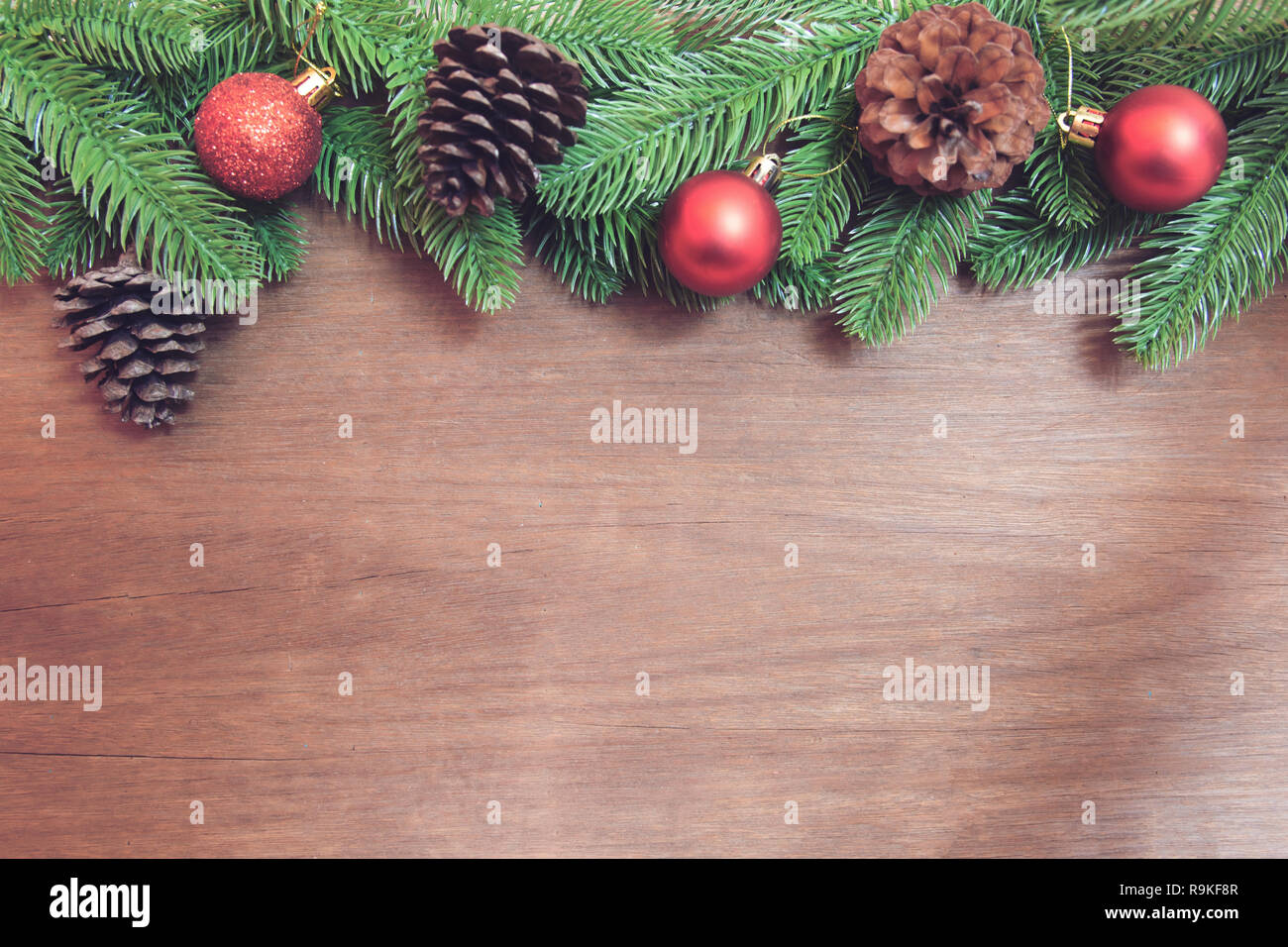 Christmas background. Fir tree branches, red Christmas ball and pine ...