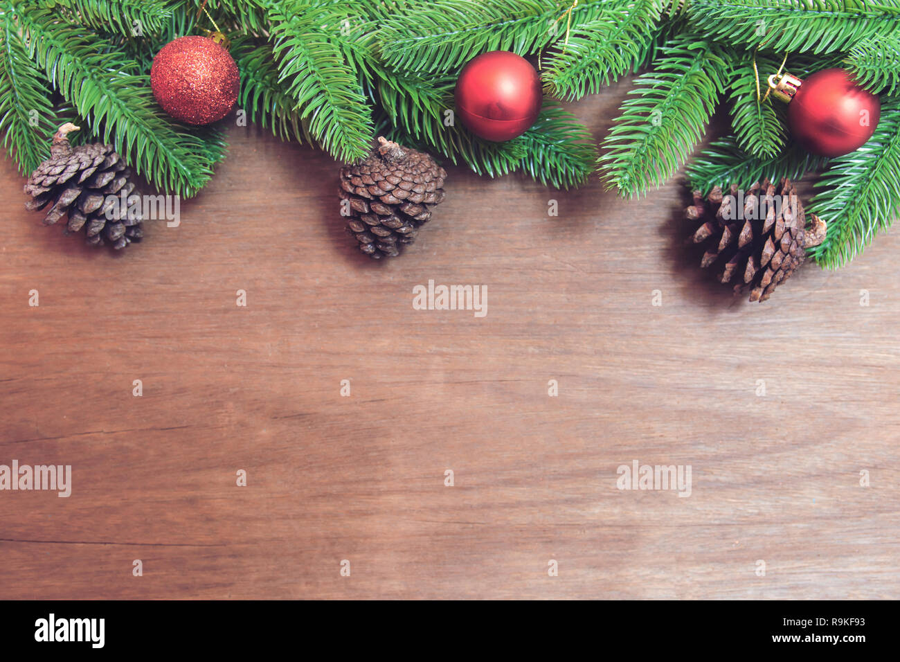 Christmas background. Fir tree branches, red Christmas ball and pine ...