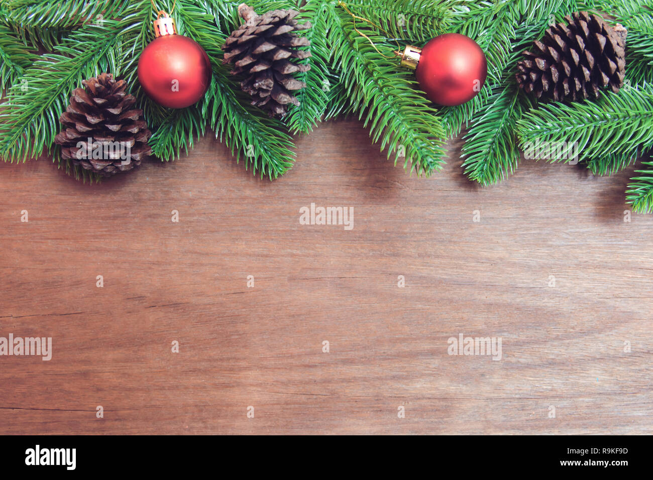 Christmas background. Fir tree branches, red Christmas ball and pine ...
